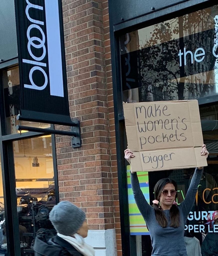 Dude & Dudette with sign, are millennials lazy? | Collater.al